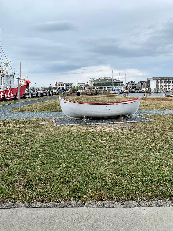 Not every vessel gets to retire with such dignity—this small boat display complements its much larger cousin in nautical storytelling.