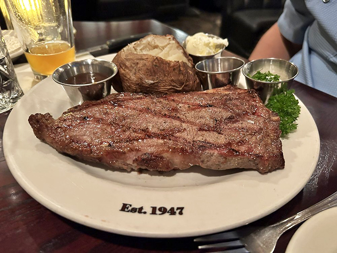 A steak so perfectly cooked it deserves its own ZIP code. The grill marks tell stories of flame-kissed perfection that vegetarians secretly dream about.