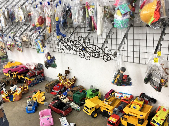 A toy paradise where plastic construction vehicles and action figures patiently wait for their next adventure with sticky-fingered commanders.