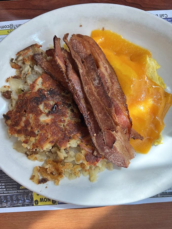This isn't just breakfast—it's a still life painting titled "Morning in America," featuring eggs with sunset-orange yolks and perfectly crisped potatoes.