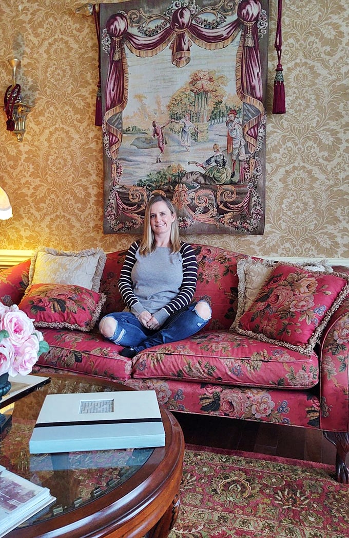 The floral sofa isn't just comfortable—it's practically a time machine to an era when people wrote letters instead of texts.