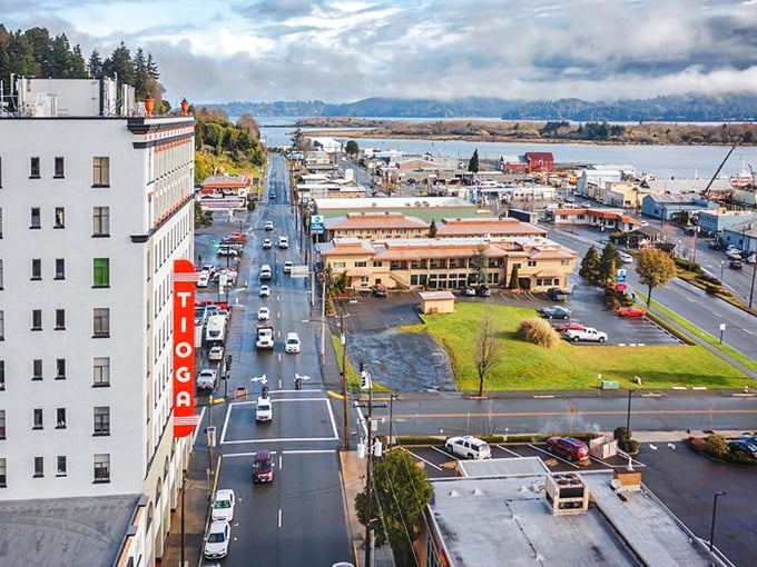 "Harbor town hustle with a view! The Tioga stands tall like a sentinel watching over the comings and goings of coastal life."