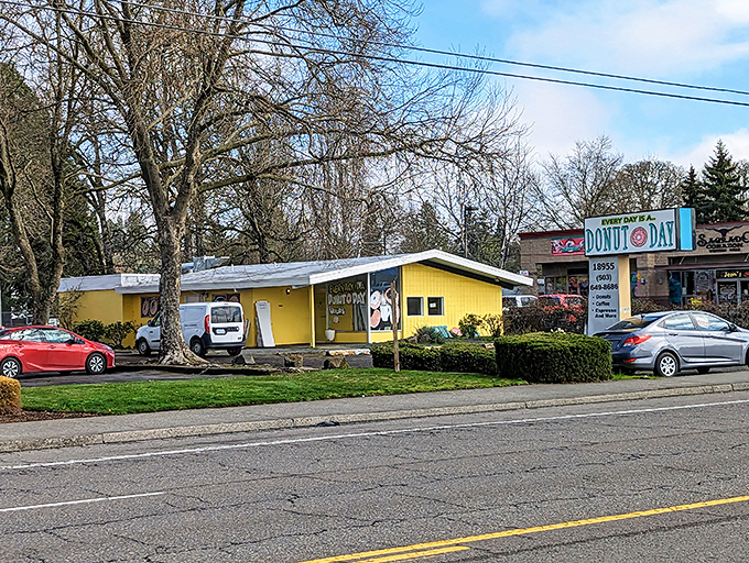 Donut Day's cheerful yellow building stands out like a happy thought. When they say "Every day is a donut day," they mean it.