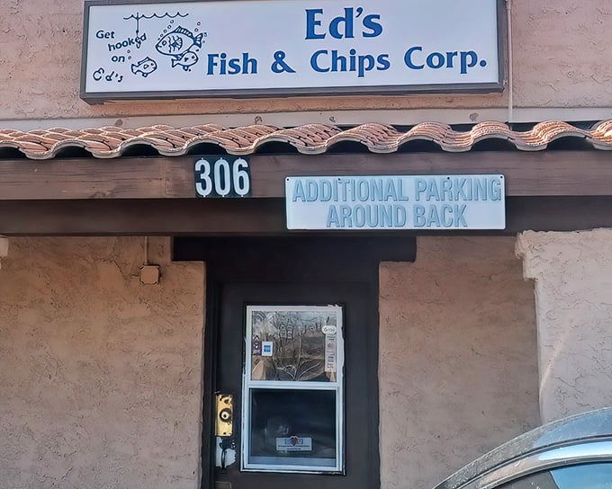 Ed's Fish & Chips doesn't need fancy signage to lure you in—just the promise of perfectly crispy fish that would make the British proud.