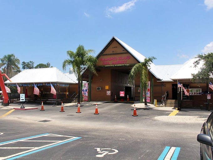 Tropical shopping paradise! Flamingo Island's palm-lined entrance welcomes bargain hunters to a distinctly Florida flea market experience with coastal charm to spare.