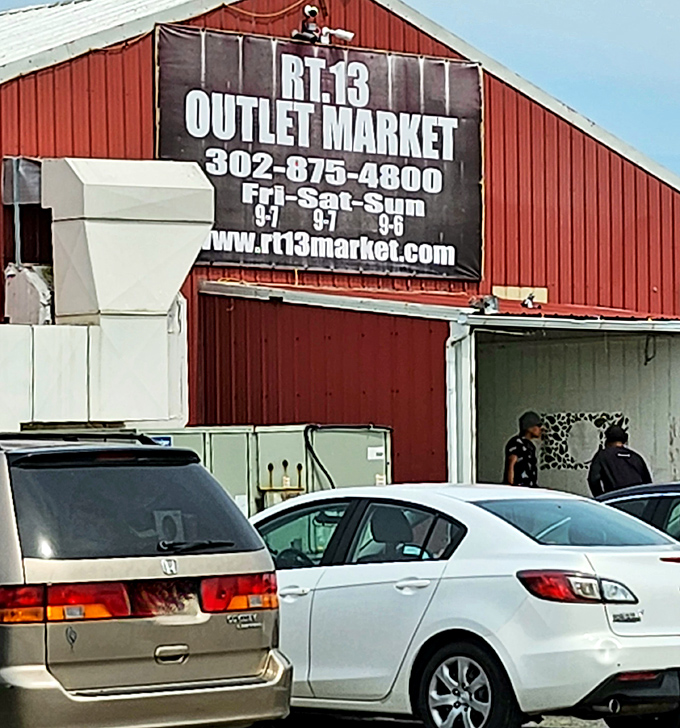 The OUTLET MARKET's bold red exterior houses racks of fashion finds waiting for their second chance at stylishness.
