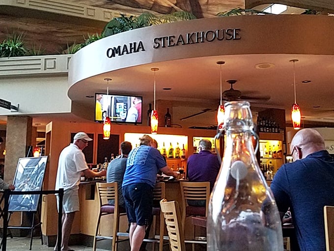 Where the serious steak business happens – Omaha's bar area welcomes solo diners and friends alike to the temple of perfectly aged beef.