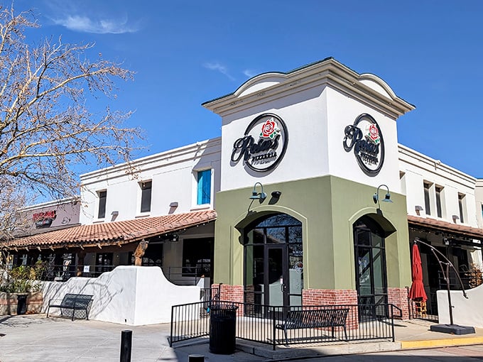Rosa's elegant storefront glows with invitation, promising pizza perfection in Prescott Valley's evening hours.
