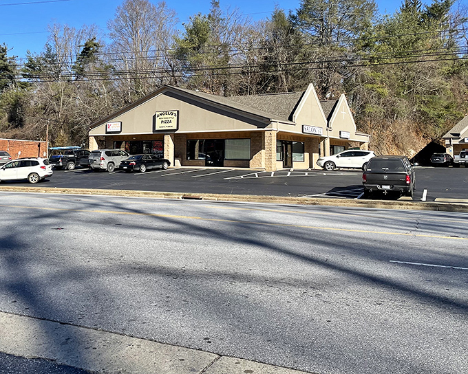 Tucked in a peaceful, tree-lined plaza, Angelo's Pizza in Arden offers a cozy, convenient spot to enjoy classic New York–style slices with plenty of parking just steps from the door.