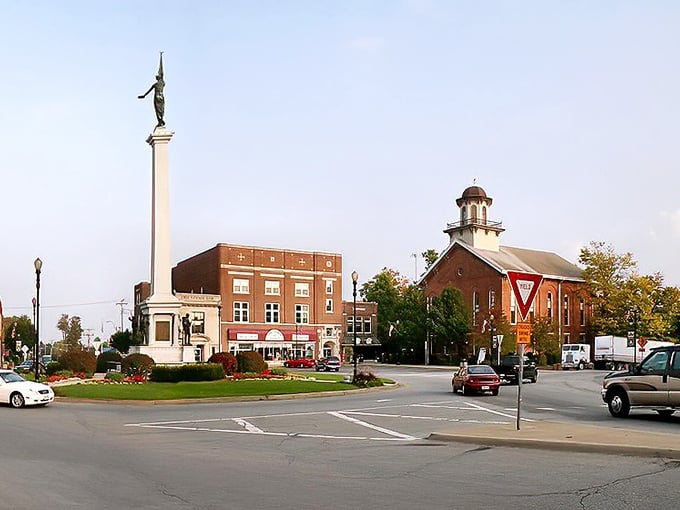 Blue skies frame Angola's historic downtown where modern businesses thrive in carefully preserved buildings.