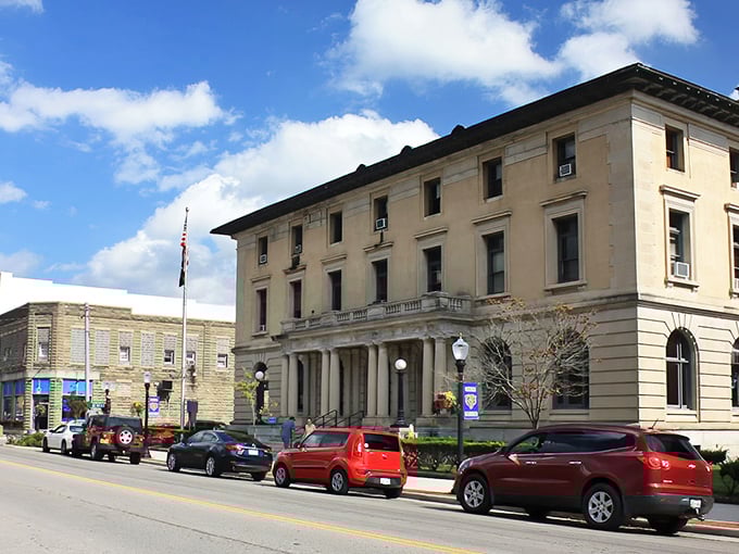 Main Street in Big Stone Gap stretches toward the mountains under a perfect blue sky. Small-town living with nature's grandeur as your backdrop.