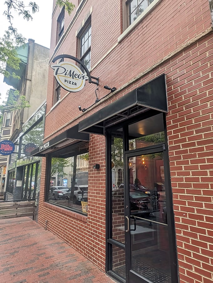Simple black awning, classic brick building—DiMeo's lets its Neapolitan-style pizza be the real showstopper.