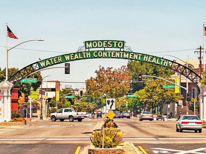 "Water, Wealth, Contentment, Health" – Modesto's promise spans this welcoming arch, where retirement dollars find their happy place.
