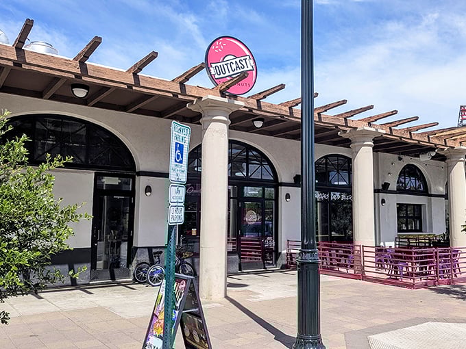 Architectural charm meets donut artistry – Outcast's patio practically begs you to sit, sip, and savor every bite.