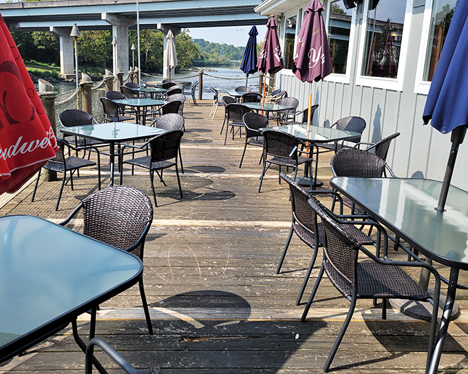 That deck at Riverfront Seafood Co isn't just a place to eat—it's front-row seating to nature's dinner theater on the water.