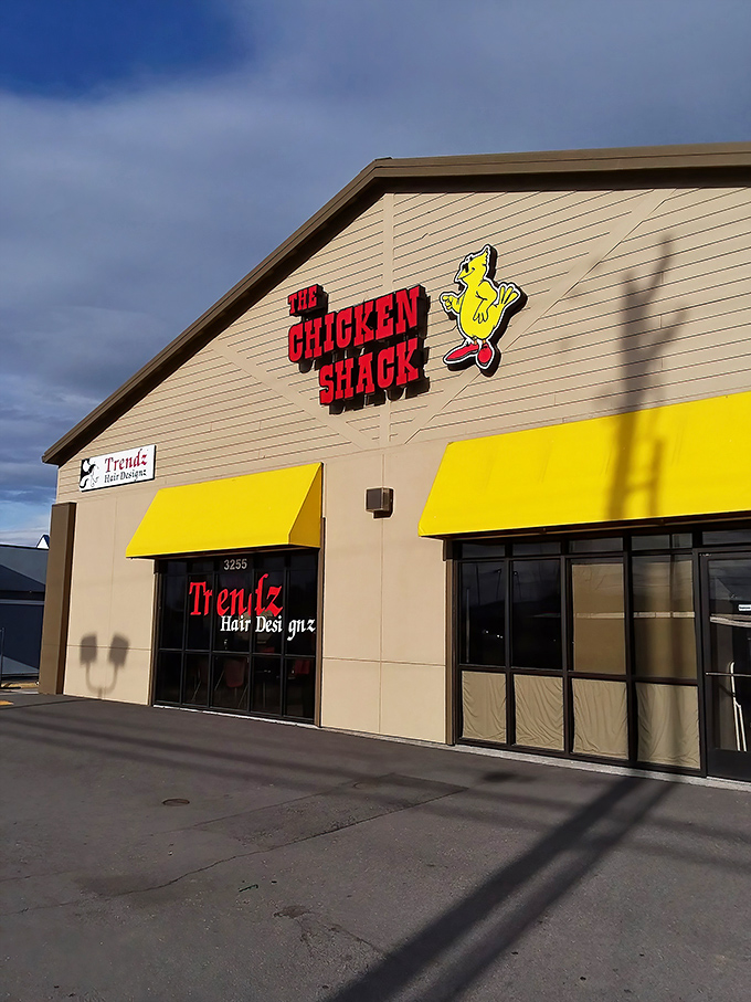 That cheerful yellow awning and cartoon chicken are like a wink that says, "Just wait until you taste what's cooking in here!"