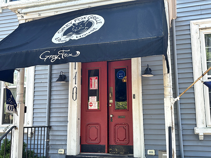 Red doors beckon beneath a classic awning – history and hamburgers make surprisingly perfect partners here.