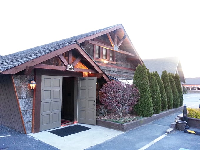 Looking like a cozy mountain retreat, The Peddler's rustic cabin exterior hints at the warm, wood-fired delights waiting inside.