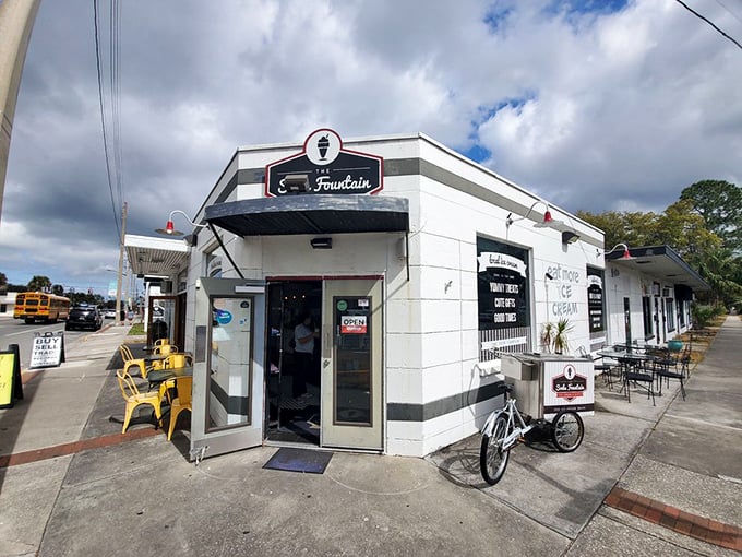 This isn't just a soda fountain – it's a time portal disguised as a neighborhood corner store, complete with bicycle delivery.