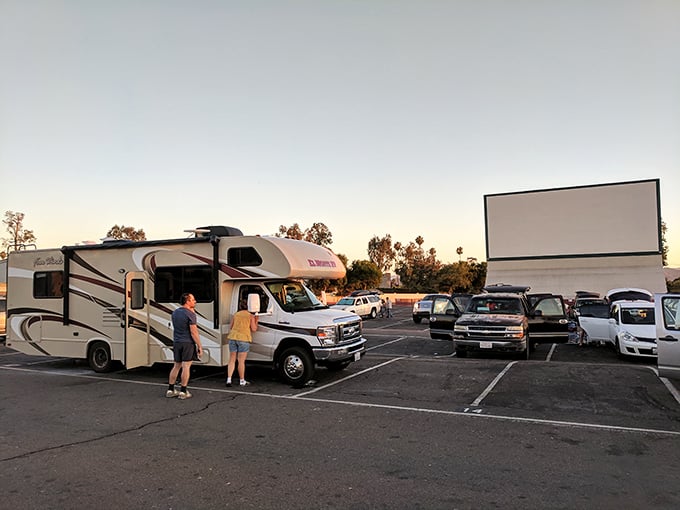 RVs and family vans claim their territory at Van Buren Drive-In, where home comfort meets Hollywood glamour.
