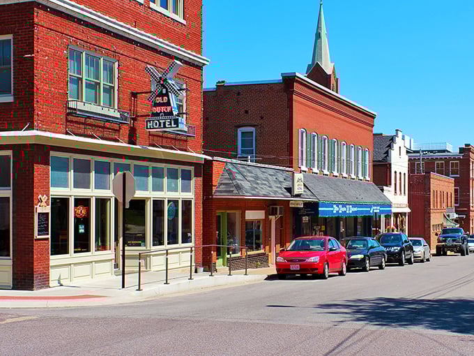 Red brick buildings stand shoulder to shoulder along Main Street. These historic storefronts have been serving shoppers since horse-and-buggy days.