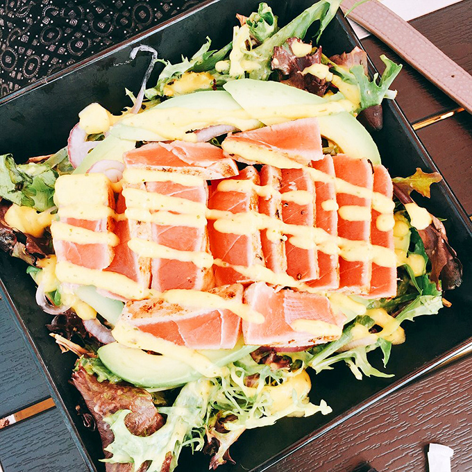 This isn't just a salad—it's a color wheel of nutrition where seared ahi tuna plays the starring role in this edible art piece.