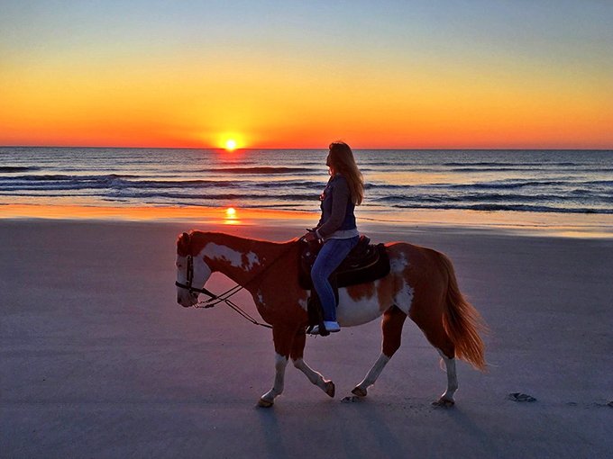 Horseback riding at sunset on Amelia Island's beaches – because sometimes nature hands you a moment so perfect it belongs on the cover of a romance novel.