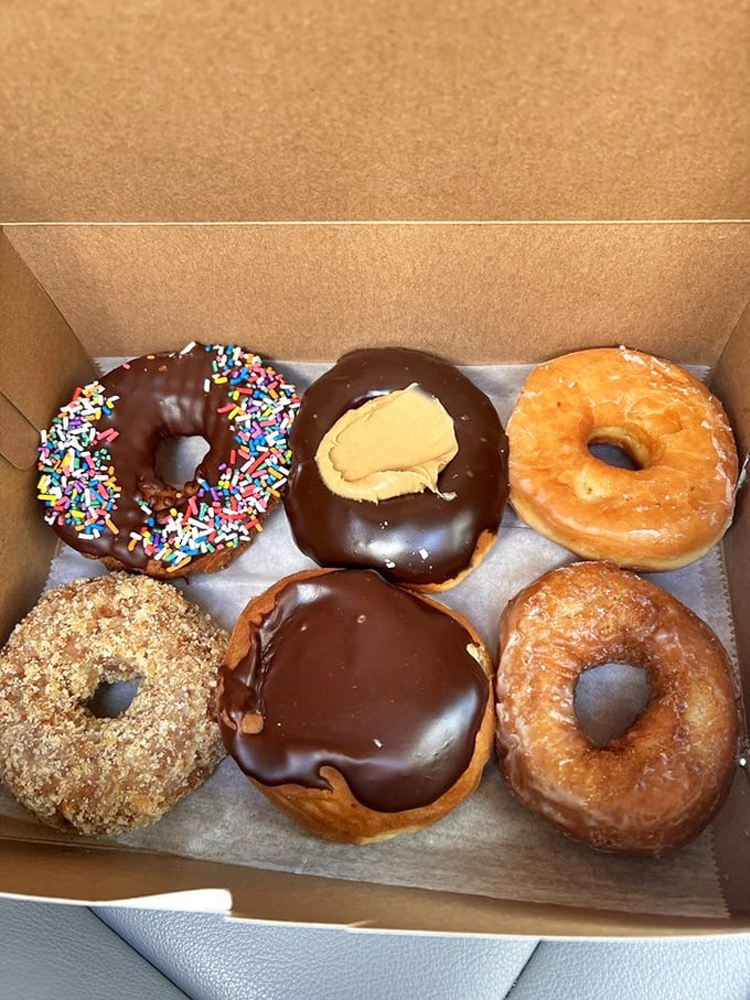 Donut diplomacy at its finest—chocolate with sprinkles for the kid in you, Buckeye-inspired for the Ohioan, and glazed for the purist.