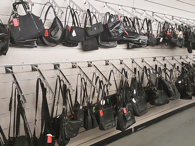 The handbag wall—where designer aspirations meet reasonable prices. Black never goes out of style, especially when it's genuine leather at thrift store prices.