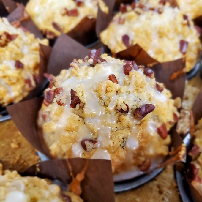 This muffin, topped with pecans and glaze, isn't just breakfast—it's what morning dreams are made of.
