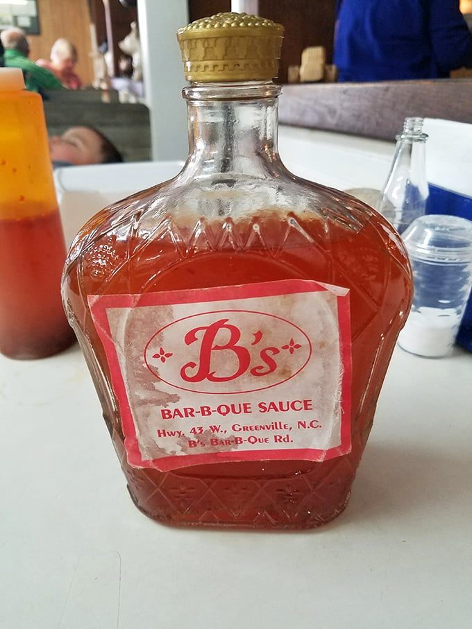 The crown jewel of Eastern Carolina—vinegar-based sauce in its natural habitat. Liquid gold for barbecue believers.