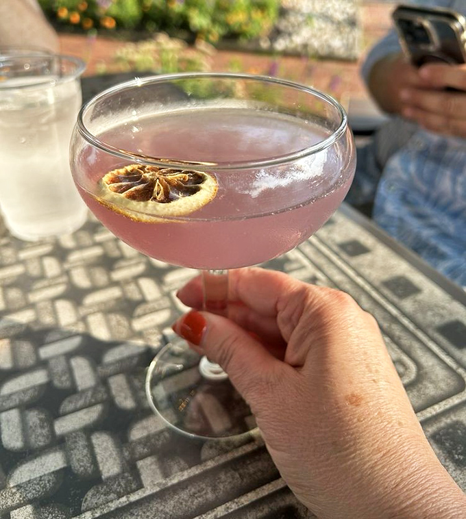 A cocktail that's dressed better than most people at the party. That dried citrus garnish isn't just for show—it's the exclamation point on a perfect sentence.