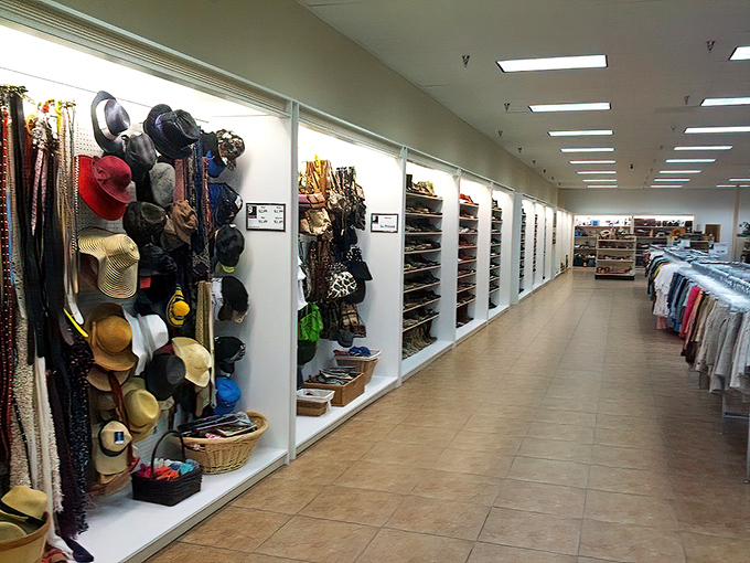The accessories wall—where vintage hats, belts, and bags wait to transform ordinary outfits into conversation starters.
