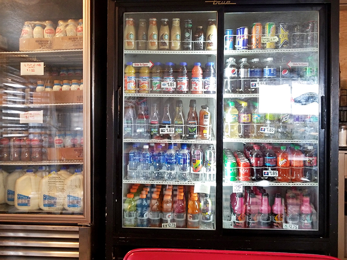 The beverage cooler at Joe's offers the perfect liquid companions for your donut adventure—because even superheroes need sidekicks.