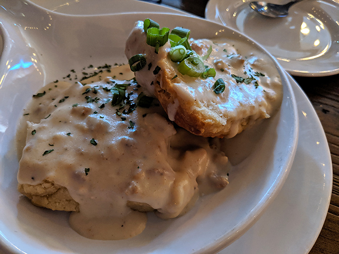Biscuits swimming in gravy so good you'll want to write it love letters. The green onions aren't just garnish—they're little flavor fireworks.