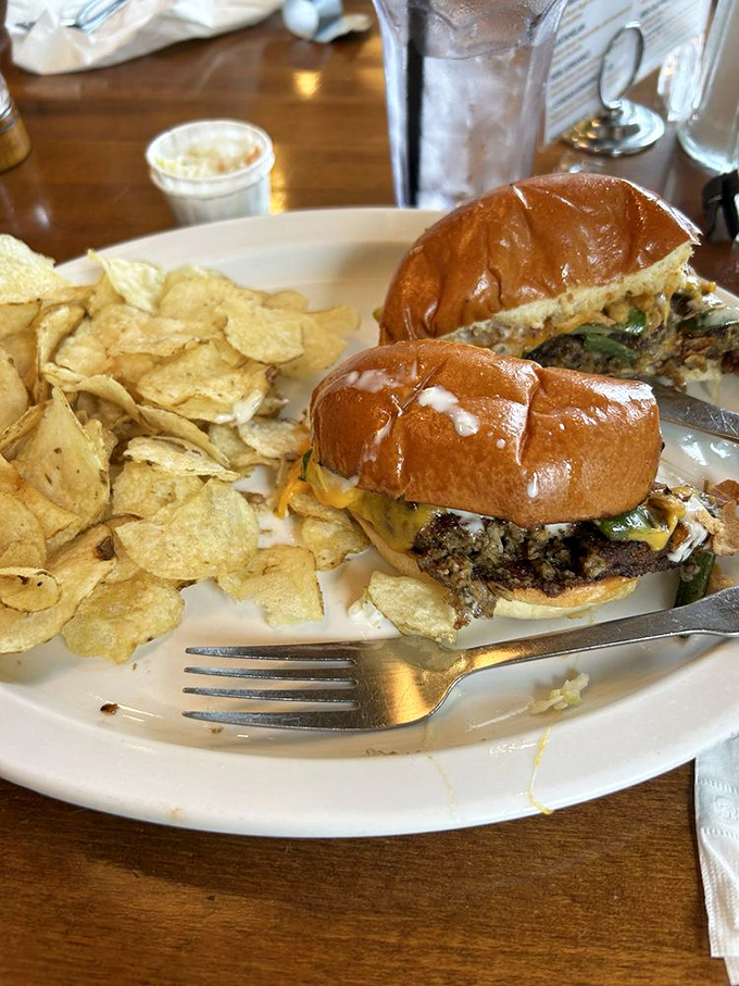 Burgers here aren't afterthoughts – this hearty creation comes loaded with melted cheese and fresh toppings, accompanied by perfectly crisp potato chips.