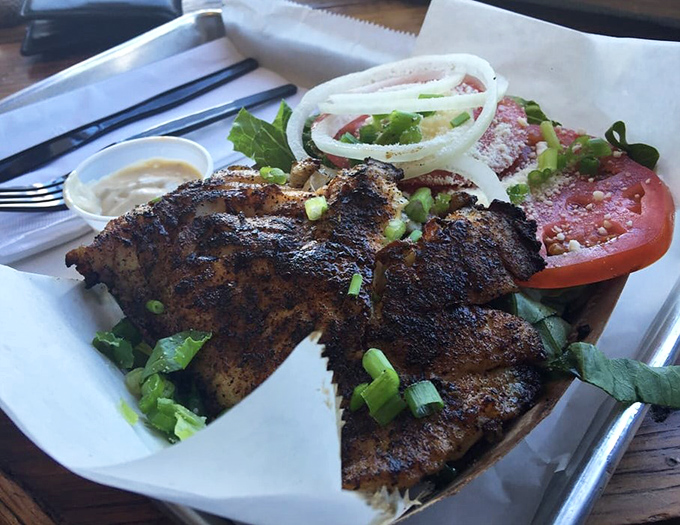 Blackened seasoning on fresh grouper creates a flavor explosion that makes this salad anything but a boring health choice.