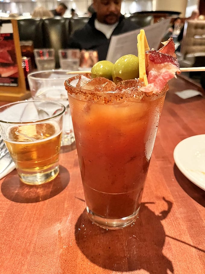 Not your average Bloody Mary—this spice-rimmed masterpiece comes armed with olives, bacon, and enough personality to be considered a dining companion.