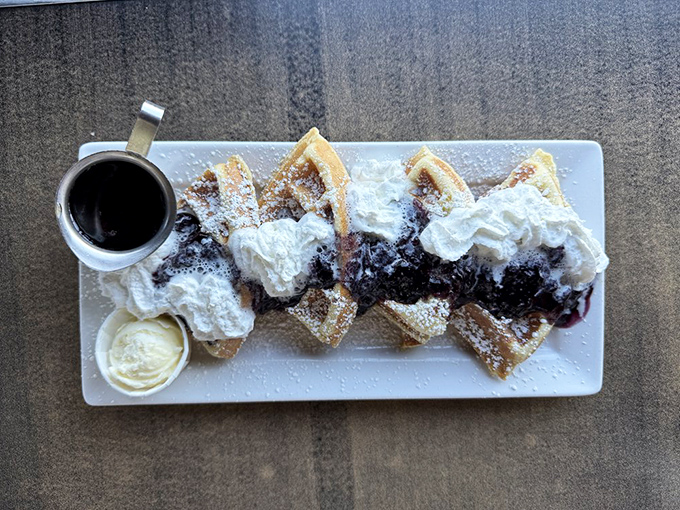 Blueberry waffles with whipped cream—because sometimes breakfast should double as dessert. No regrets here.