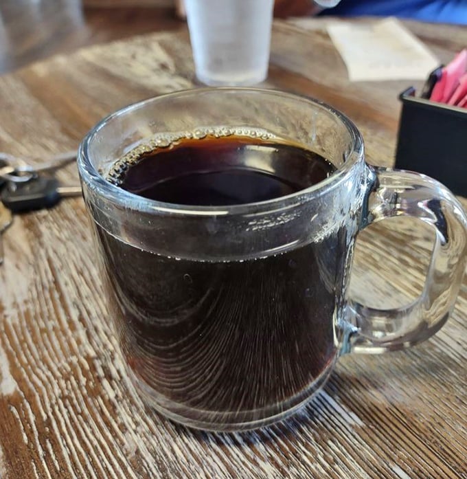 Coffee served in a clear mug – because when it's this good, you want to see what you're drinking. The perfect bitter companion to sweet pie indulgence.
