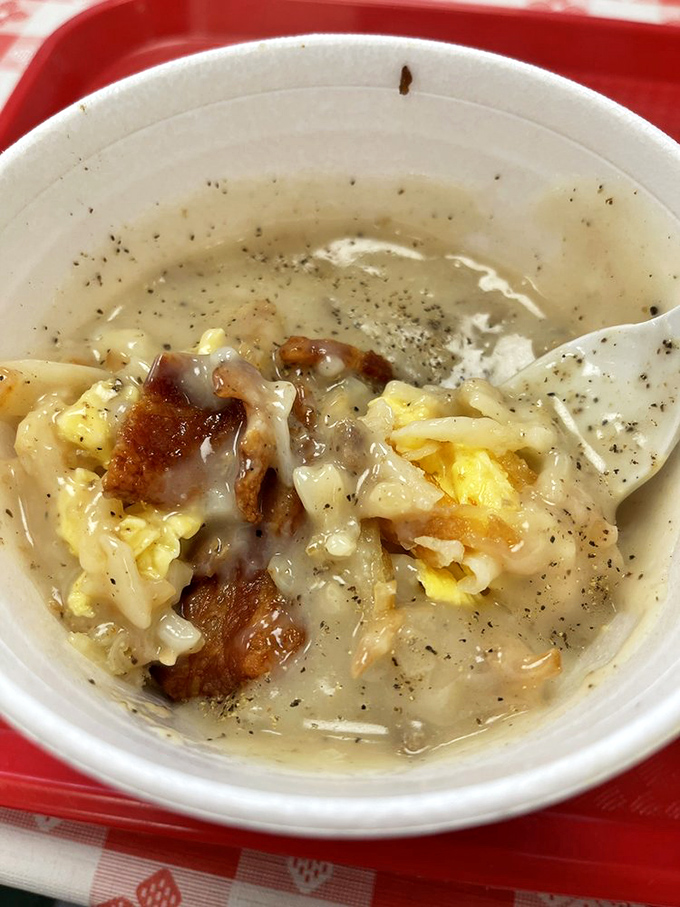 Breakfast in a bowl: eggs, bacon, and whatever else the kitchen decided you needed today—a morning symphony of comfort.