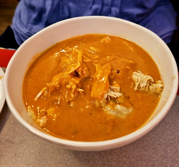 This paprikash soup isn't just orange—it's a sunset-colored pool of chicken, paprika, and soul-warming goodness that defies simple description.