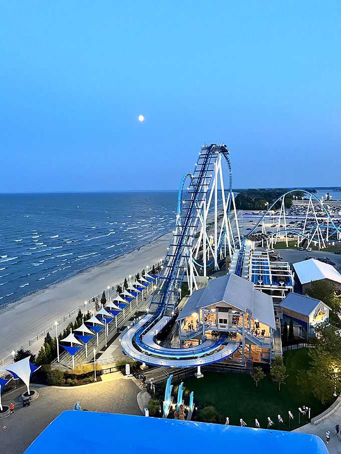The moon rises over Lake Erie as Cedar Point's coasters cut dramatic silhouettes – a spectacular view worth the short drive from Ada.
