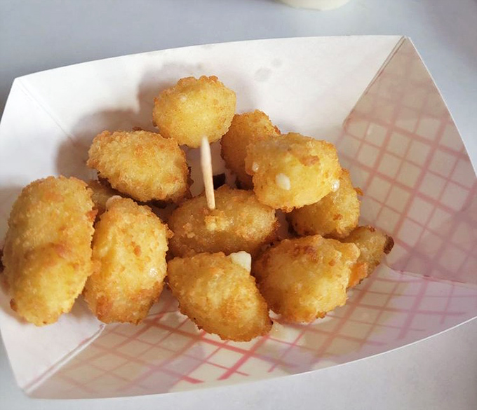 Golden cheese balls that crunch like nature's perfect snack—proving that sometimes the best things in life are simple, fried, and dusted with salt.