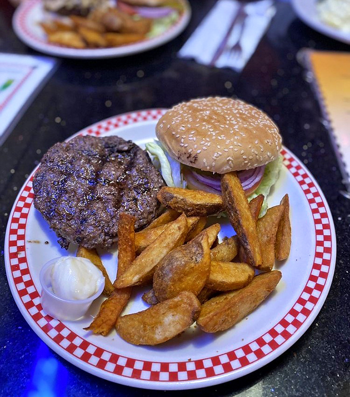 A proper diner burger doesn't need truffle aioli or fancy names—just honest beef, proper toppings, and fries that could stand alone as a meal.