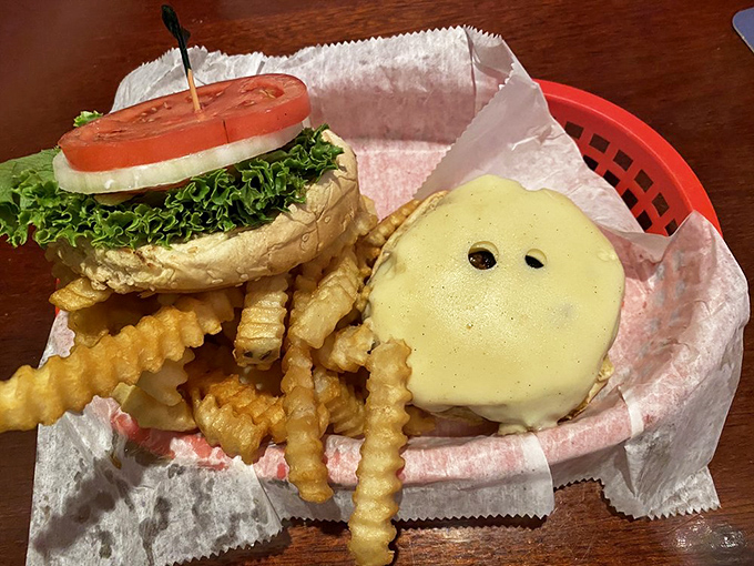 Simplicity elevated to an art form. The melted cheese blankets the patty like Florida sunshine, while those crinkle-cut fries demand equal attention.