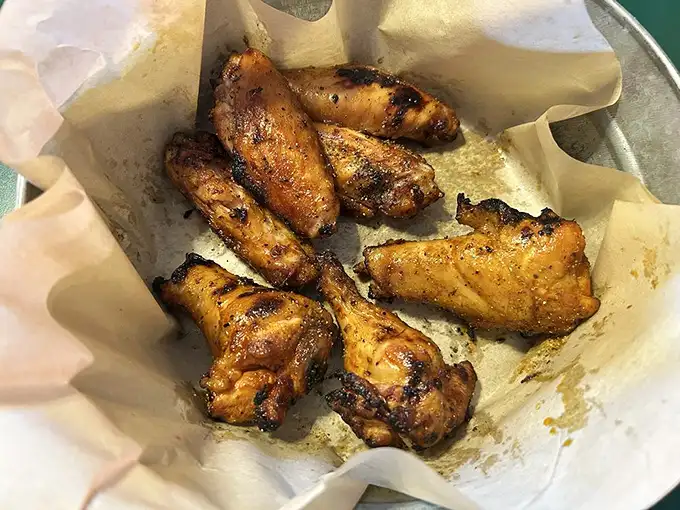 Wings that have achieved that perfect balance of smoke, spice, and tenderness—the barbecue equivalent of hitting the lottery.