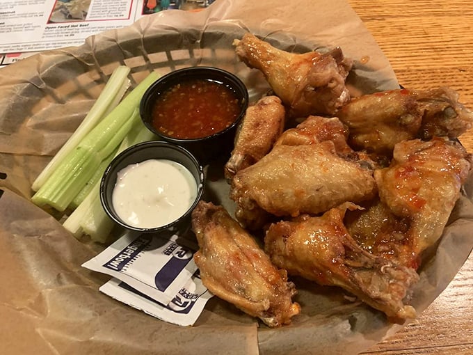 These wings aren't trying to fly under the radar—crispy, saucy, and served with cooling dips and celery, they're the perfect tavern companion.