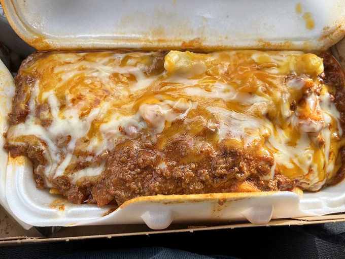 Behold the chili cheese burrito—where molten cheese cascades over savory chili in a styrofoam container that barely contains all that deliciousness.