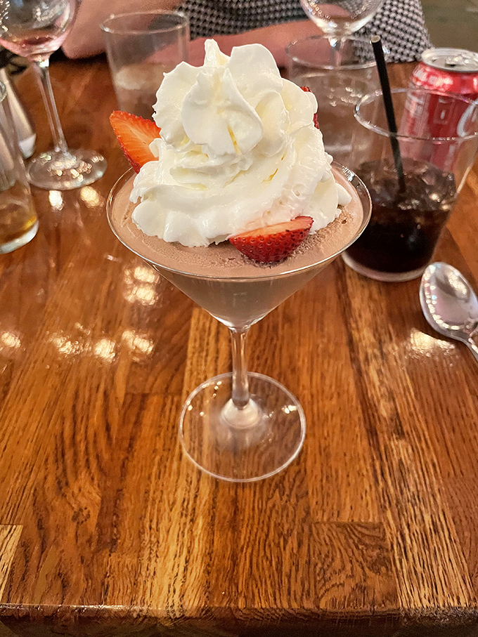 This dessert isn't just eating—it's an event, with whipped cream architecture that deserves its own exhibit at the Smithsonian.
